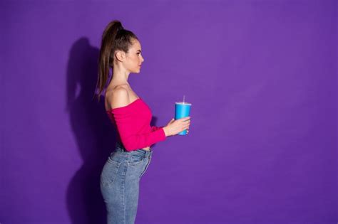 Premium Photo Profile Photo Of Lovely Calm Lady Hold Cup Look Copyspace Wear Denim Jeans Pink