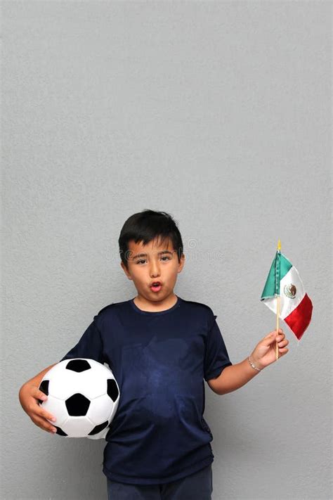 Mexican Year Old Boy Plays With A Soccer Ball And Flag Very Excited That He Is Going To See
