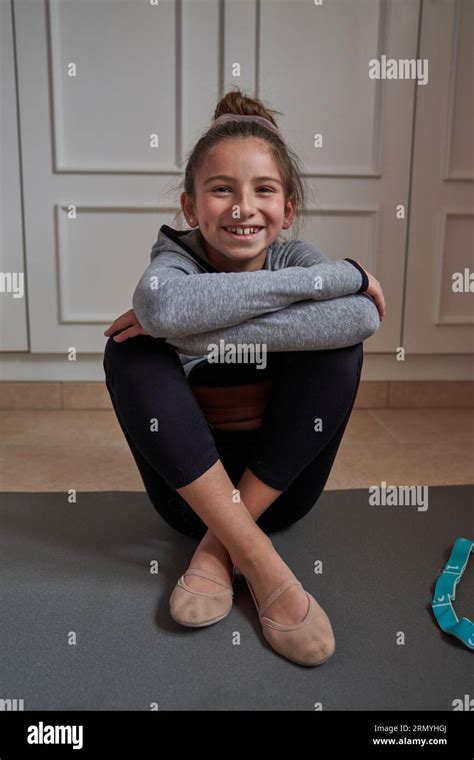 Full Body Portrait Of Positive Preteen Gymnast In Sportswear Smiling