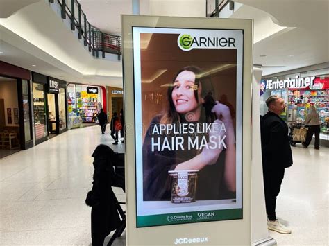 Digital Advertising Screen With Garnier Hair Care Product In A Shopping