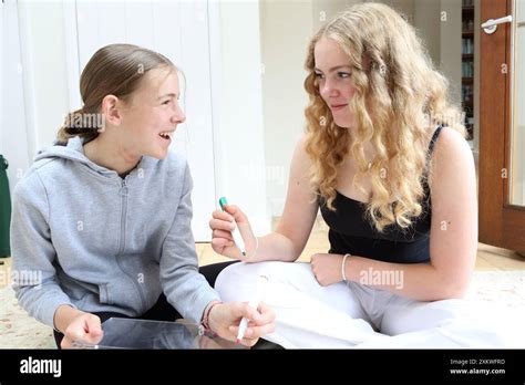 Girls Doing Maths Math Sitting On Floor Writing On Whiteboard With Pens Algebra Fractions