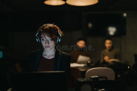 Focused Businesswoman Analyzing Sales Statistics And Planning Project