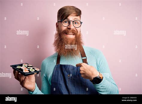 Redhead Irish Cook Man With Beard Holding Maki Sushi Tray Over Isolated
