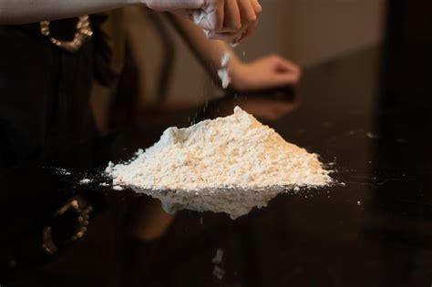 Premium Photo Flour On Glass Table