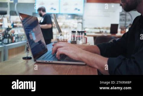 Data Scientist Programmer Analyzing And Visualizing Data On His Computer Surrounded By Charts
