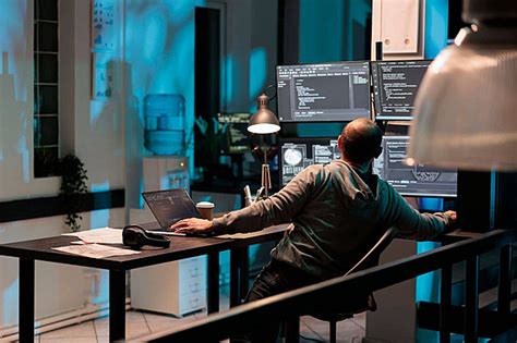 Software Developer Typing Programming Code On Computer Interface