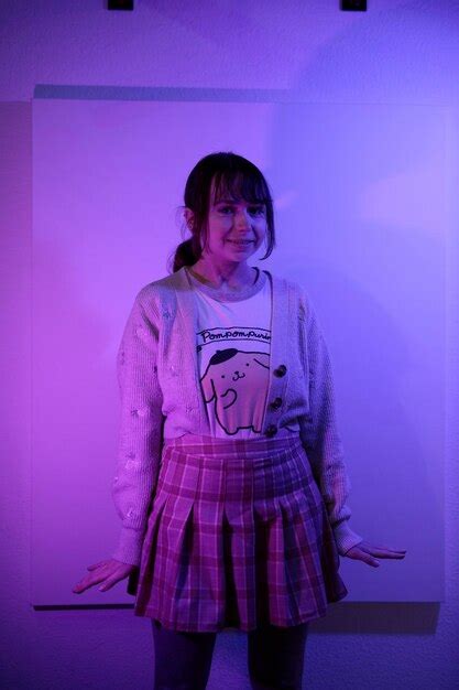 Premium Photo Young Woman Standing Against Wall