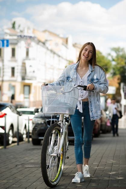 Free Photo Front View Woman Walking Next To Her Bike