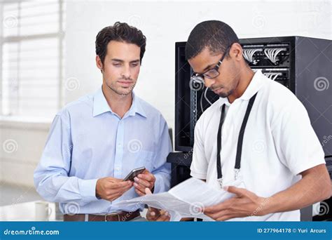 Server Room It Support And Reading With An Engineer Working With A