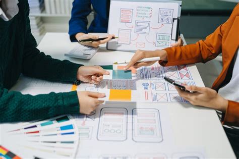 Ux Developer And Ui Designer Brainstorming About Mobile App Interface
