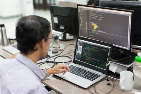 Asian Outsource Software Developer Looking Screen Sitting At Desk Stock Image Image Of Coding