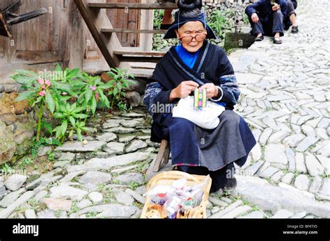 A Elderly Miao Street Vendor Sewing Upper Langde Miao Village Leishan