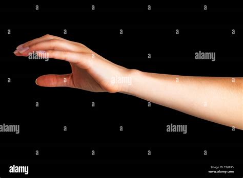 Woman Hand Showing Picking Up Pose Or Holding Something On Black Background Isolated With