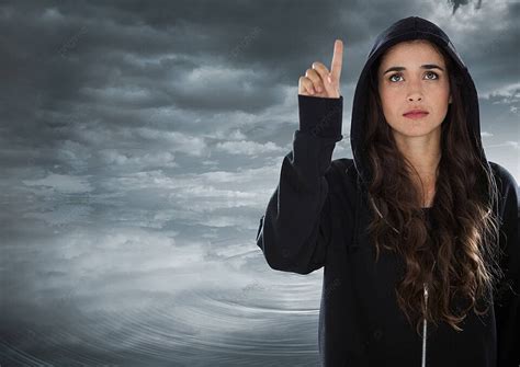 Female Hacker Pointing Finger In Front Of Cloudy Sky Photo Background And Picture For Free