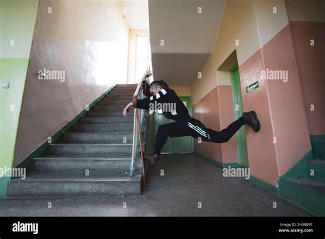 Athletic Androgynous Strong Dancer Balances Pose On Colourful Wall