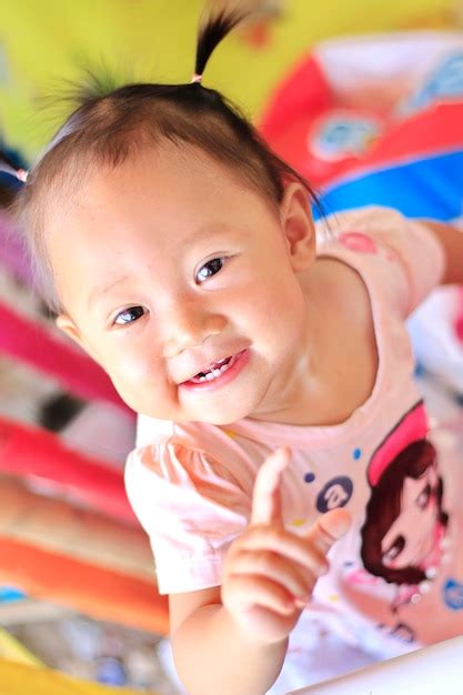 Premium Photo High Angle Portrait Of Smiling Cute Girl