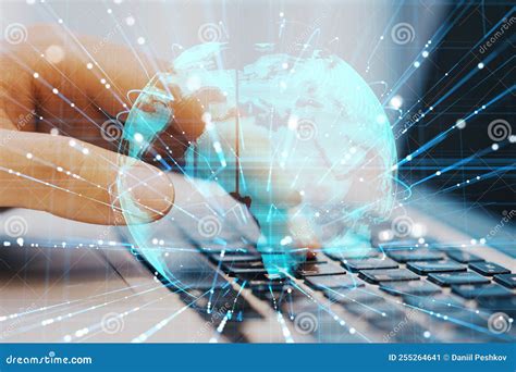 Close Up Of Hands Using Laptop Keyboard With Abstract Globe Hologram With Connections On Blurry