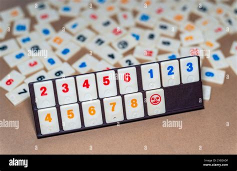 Classic Board Game Of Rummikub Tiles With Numbers In Sequence Focus