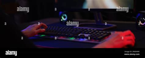 Female Cyber Hacker Gamer Using Keyboard And Mouse To Playing Games Or