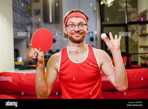 Funny Crazy Athlete Nerd With Ping Pong Table Tennis Racket And Ball At Home Stock Photo Alamy