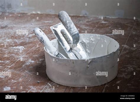 Applying Decorative Putty White Abstract Texture Of Surface Covered