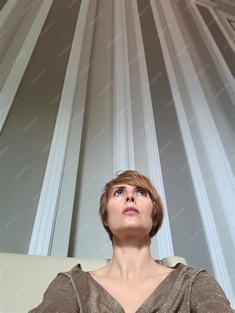 Premium Photo Low Angle View Of Young Woman Looking Up