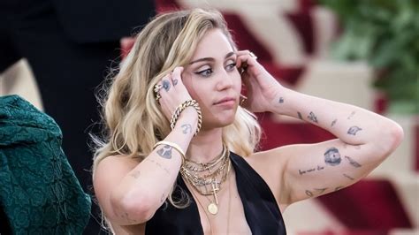 The Tattoos Miley Cyrus Got With Liam Hemsworth And Their Meaning Yaay