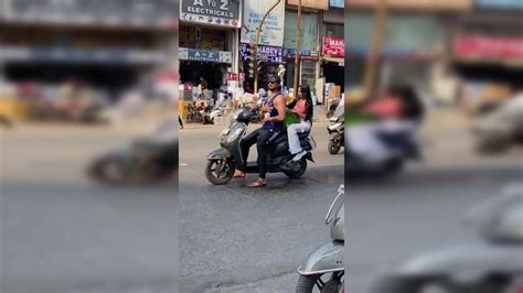 Man And Woman Take Bath Together On Bike In Middle Of Road In Maharashtras Ulhasnagar Watch