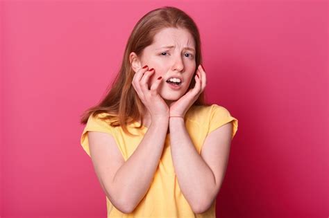 Free Photo Portrait Of Displeased Upset Female Frowns Face As She