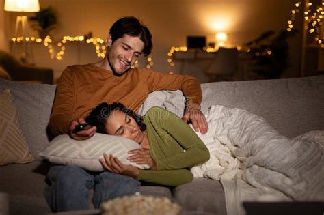 Loving Boyfriend Enjoys Cozy Movie Night While Girlfriend Sleeps On The
