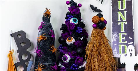 Three Halloween Themed Mini Trees Decorated With Orange Black And