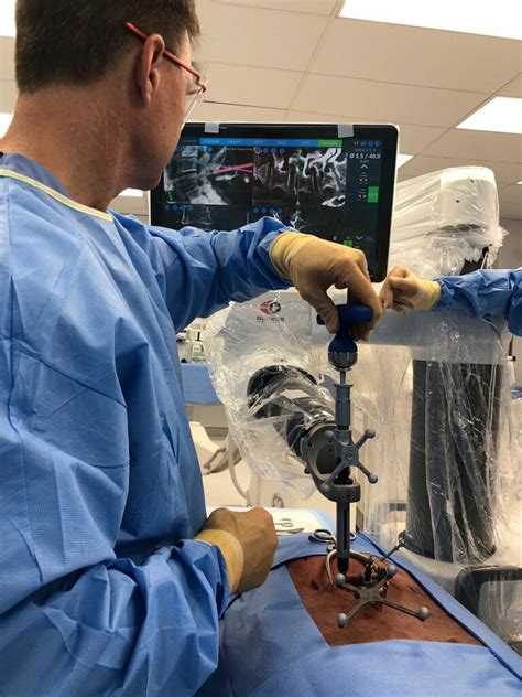 Globus And Brain Lab Robotic Navigation Systems For Spine Surgery