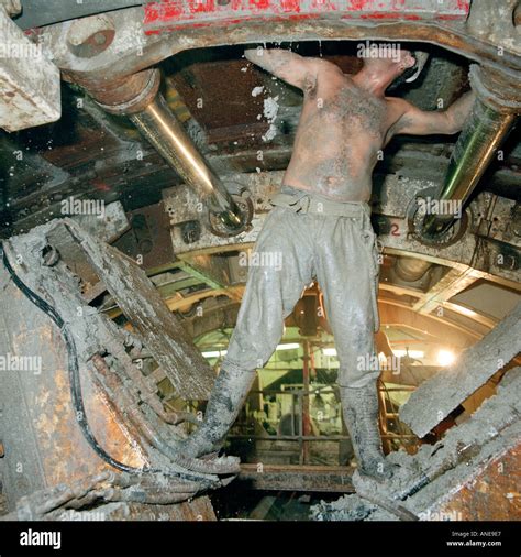 A Channel Tunnel Engineer Carries Out Essential Maintenance On A Huge Undersea Tunnel Boring