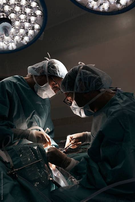 Team Of Surgeons Operating In The Hospital By Santi Nuñez In 2022