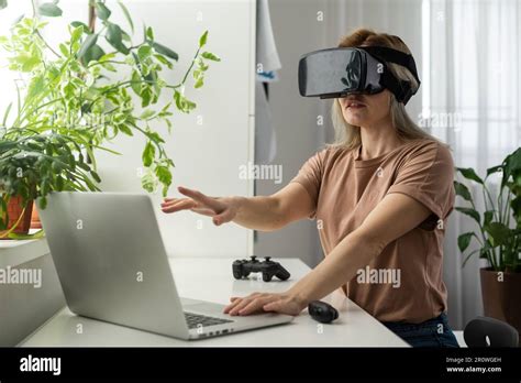 Woman In Vr Headset Looking Up At The Objects In Virtual Reality Vr Is