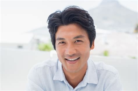 Premium Photo Smiling Man Looking At Camera