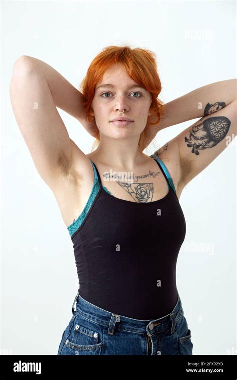 A Beautiful Woman In Her Mid Twenties With Tattoos And Unshaved Armpits