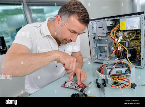 Fixing A Broken Computer Stock Photo Alamy