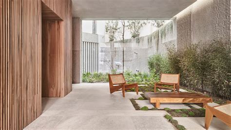 Wood Screens And Green Courtyards Define Apartment Block In Mallorca By Ohlab
