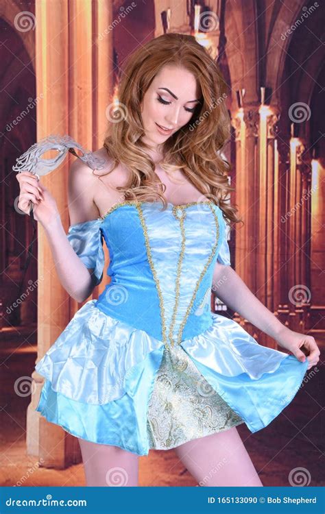 Beautiful Tall Slim Busty Redhead Model Dressed As Cinderella At The Ball Stock Photo
