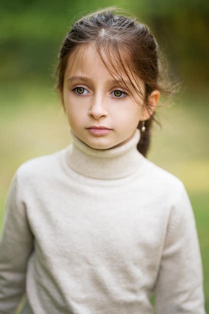 Premium Photo Close Up Of Cute Girl Standing Outdoors