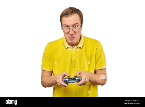 Geek Gamer Nerd In Glasses And Yellow T Shirt With Gamepad Isolated On White Background Young