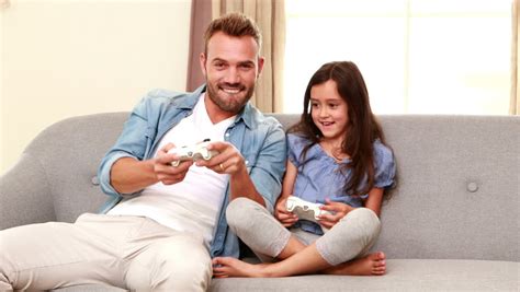 Happy Daughters Play Video Games With Dad The Frisky