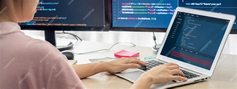Premium Photo Female Developer Coding On Laptop While Computer Display Program Burgeoning