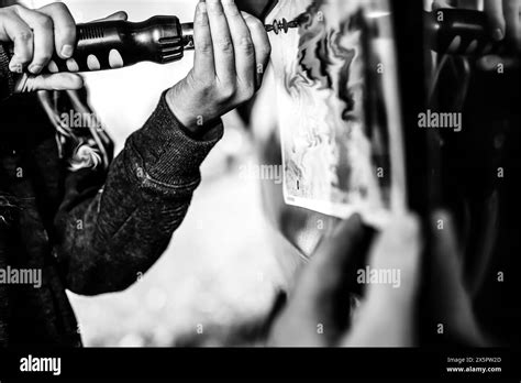 Using A Screw Driver To Remove And Replace A Vehicle Rear License Plate Stock Photo Alamy