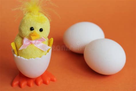 White Chicken Eggs And A Toy Chicken Next To Them A Yellow Toy Chicken