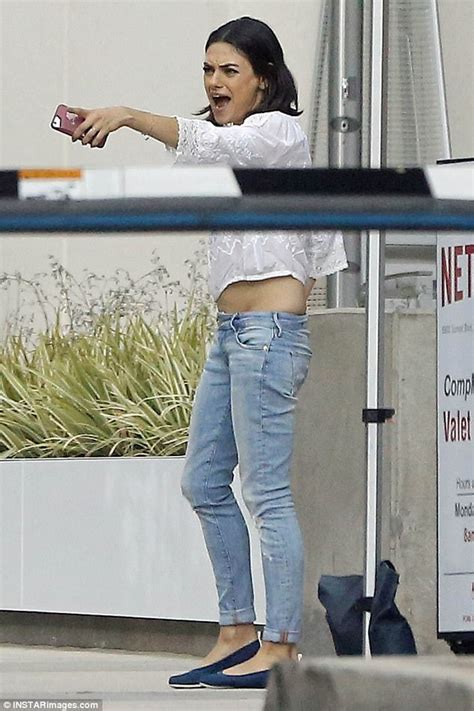 Mila Kunis Flashes A Bit Of Midriff In A Sheer White Top Daily Mail Online