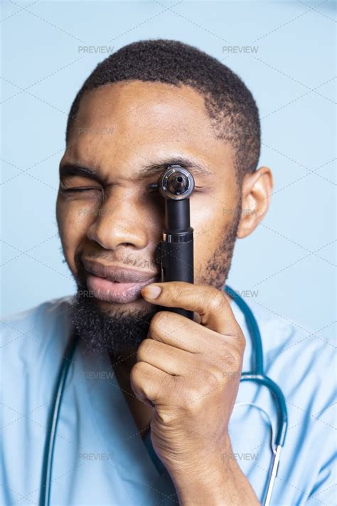 Nurse Specialist Does An Ear Drum Examination To Check The Ear Canal
