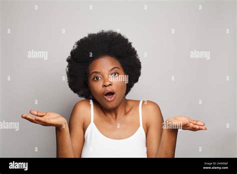 Confused Young Cute Brunette Woman Shrugging Shoulders Uncertain