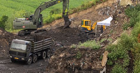 ten war victims found in mass grave at croatian garbage dump more expected reuters